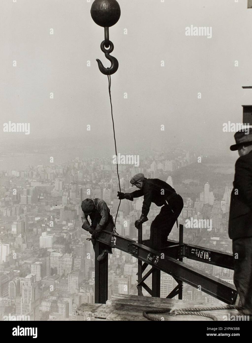 High on the Empire State Building, New York. 1930. Workers in ...