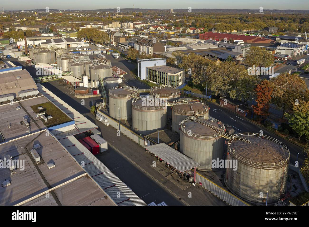 Stainless steel tanks storing chemicals at the Rhine river in Germany ...