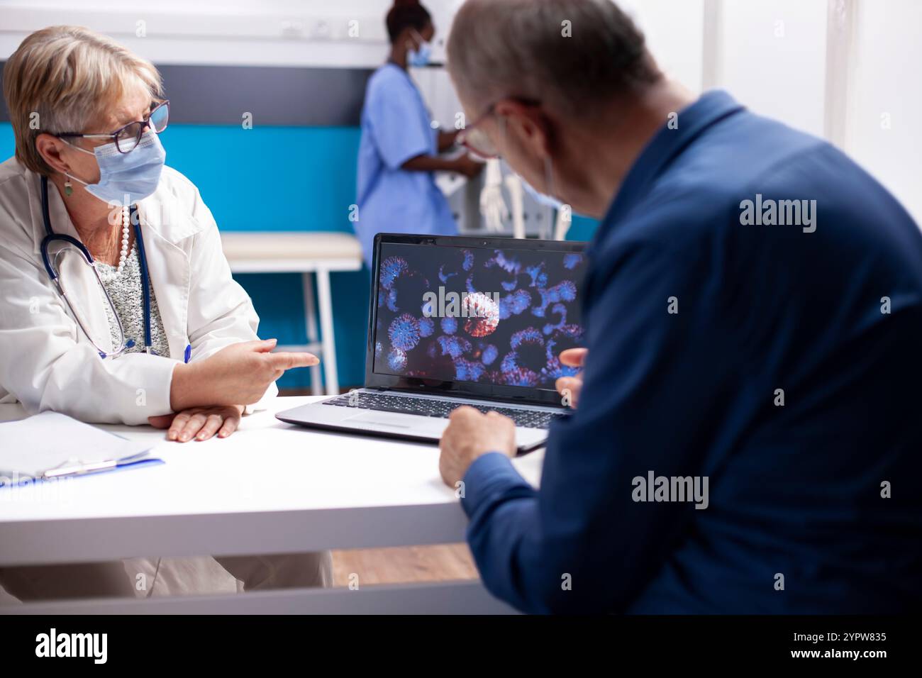 Female senior doctor provides virus diagnosis to pensioner patient as ...