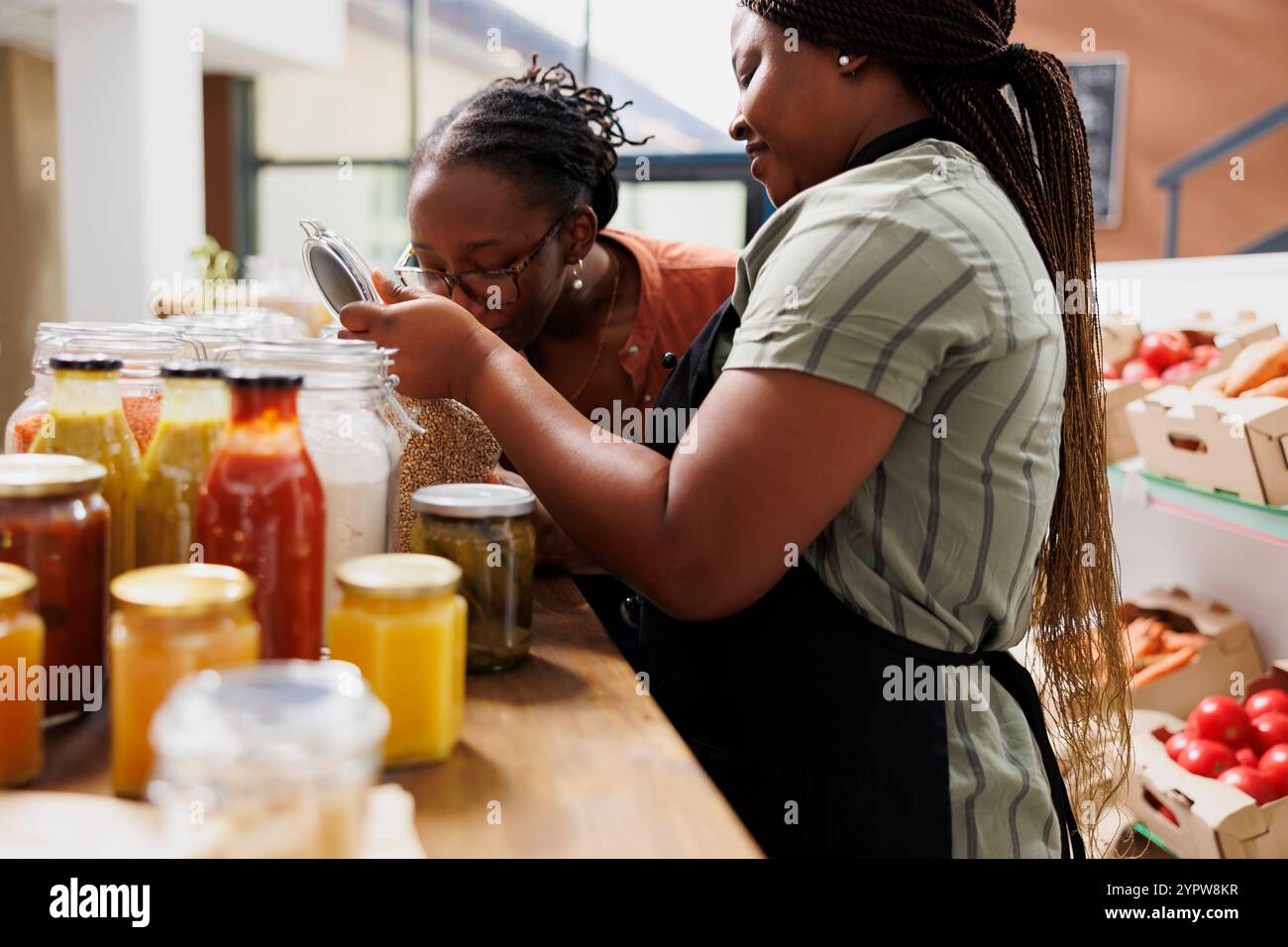 Black shopkeeper hi-res stock photography and images - Alamy