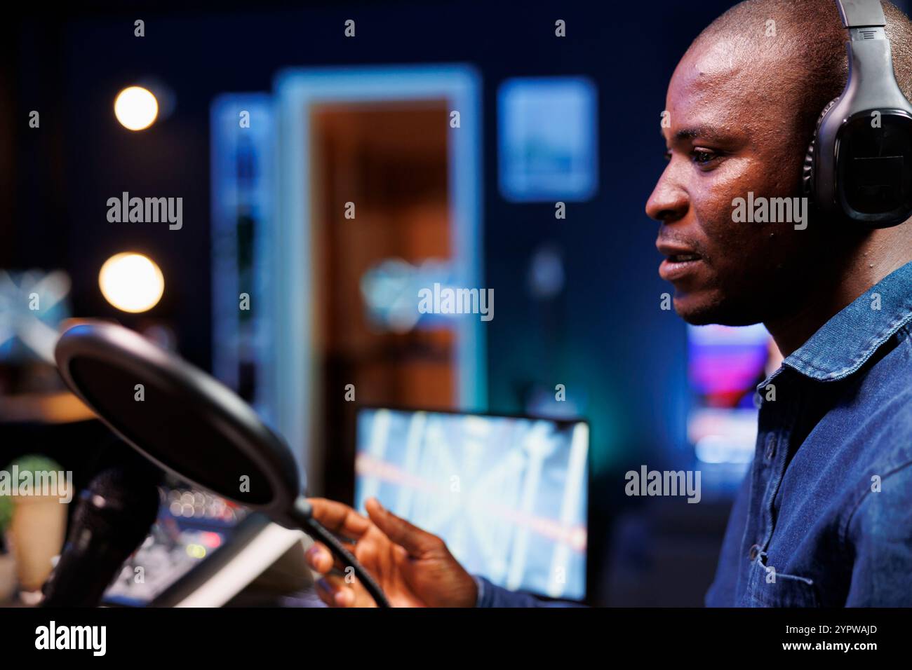 Detailed view of male african individual wearing wireless headphones ...