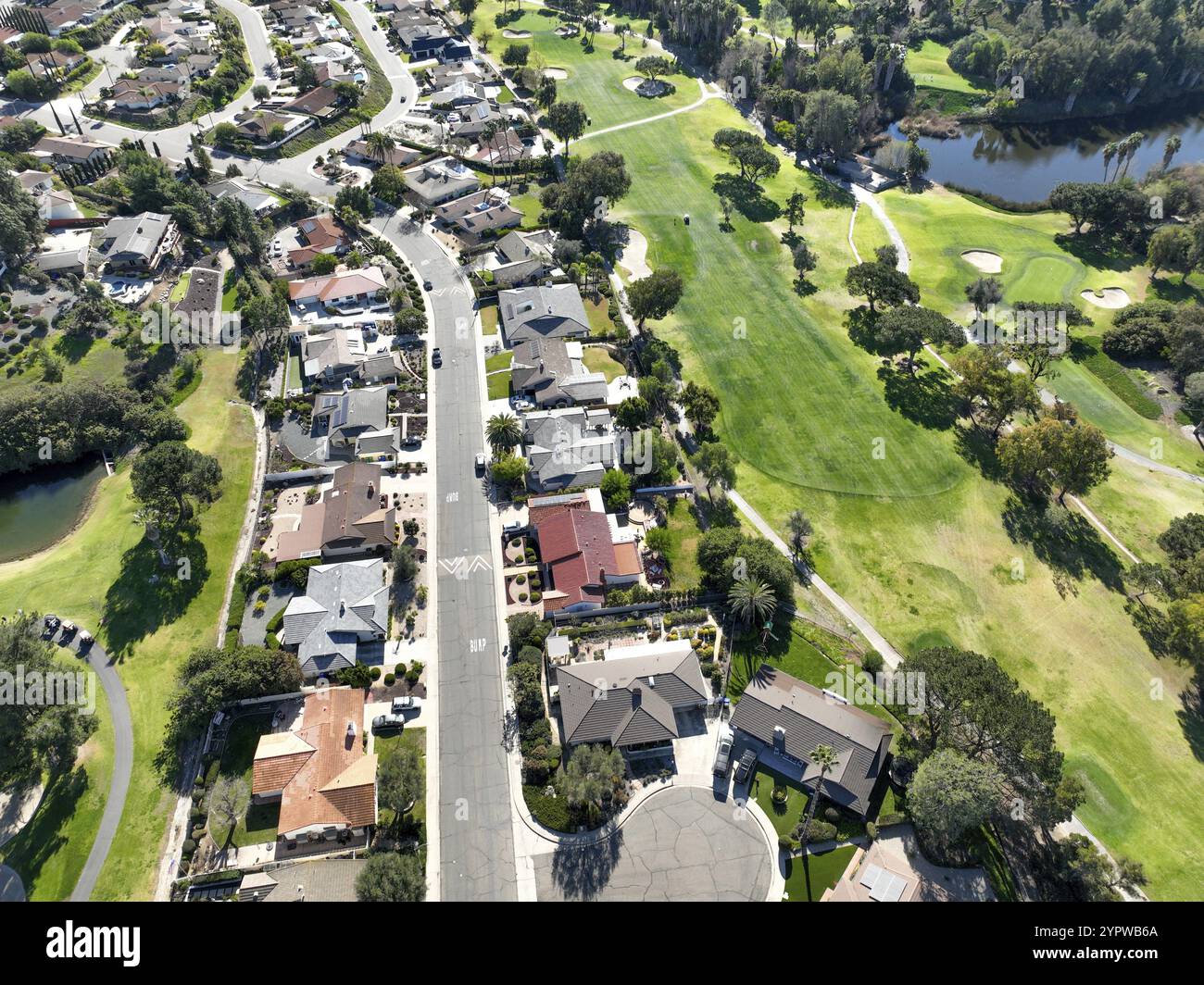 Aerial view of green golf in upscale residential neighborhood in South ...