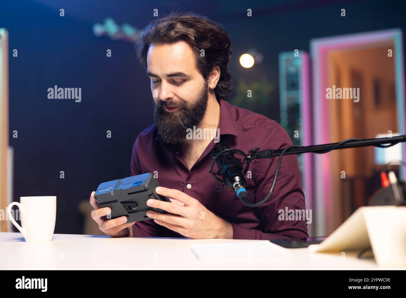 Tech content creator filming technology review of newly released V ...