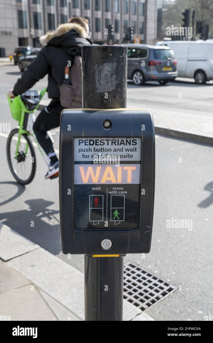 UK pedestrian crossing. Pedestrian crossing button showing WAIT sign on ...