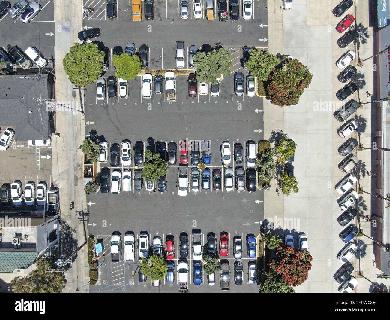 Aerial top view of parking lot with varieties of colored vehicles ...