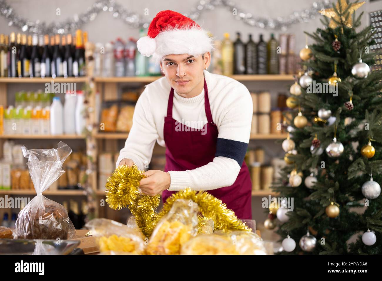 Guy decorates christmas tree hi-res stock photography and images - Alamy