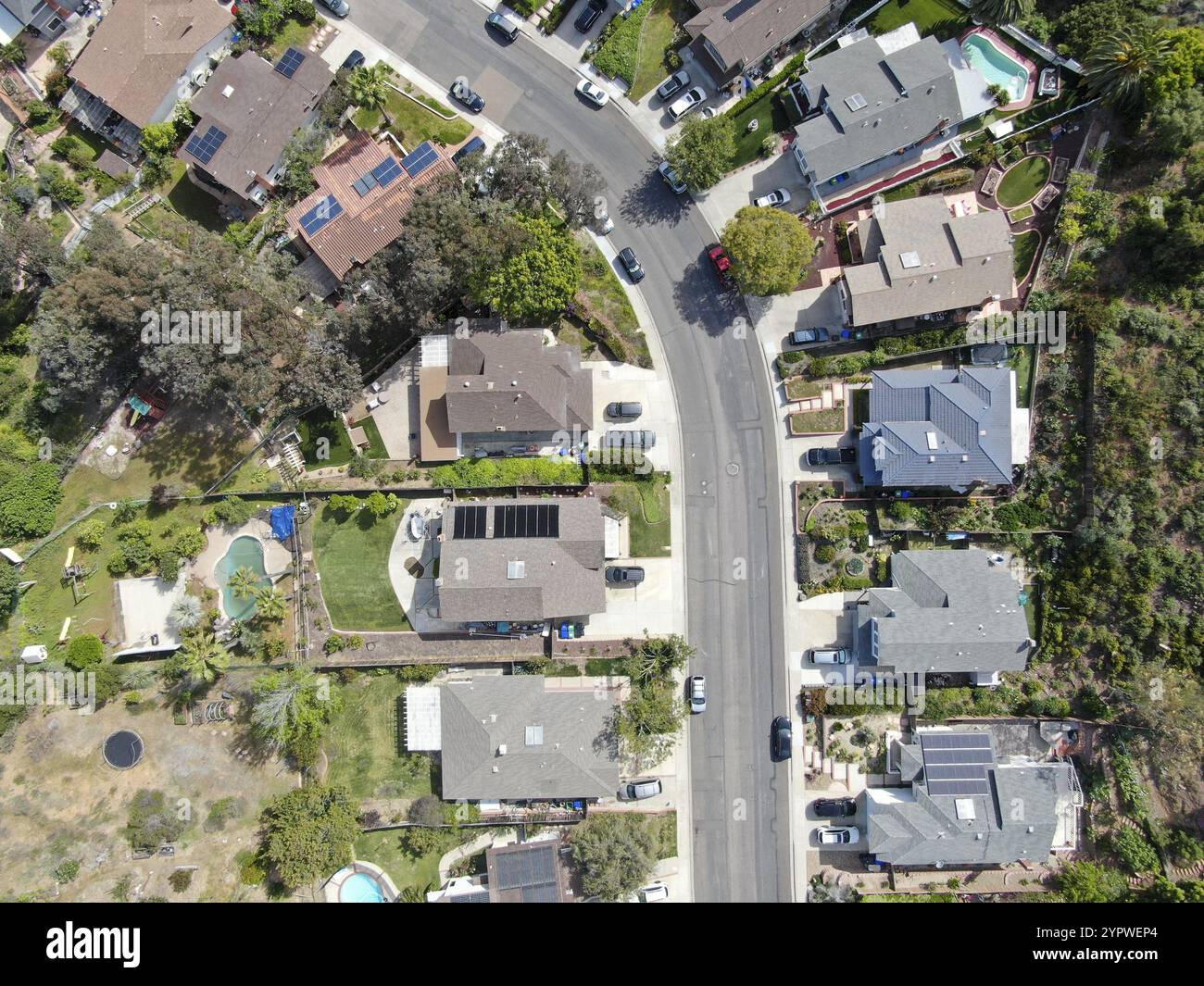 Aerial top view of upper middle class neighborhood street with ...