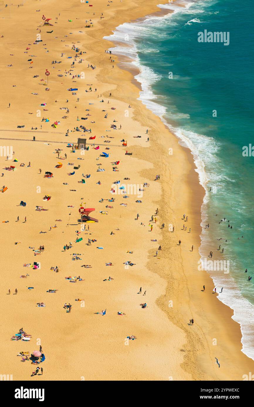 Aerial view of praia de nazare beach showing tourists relaxing ...