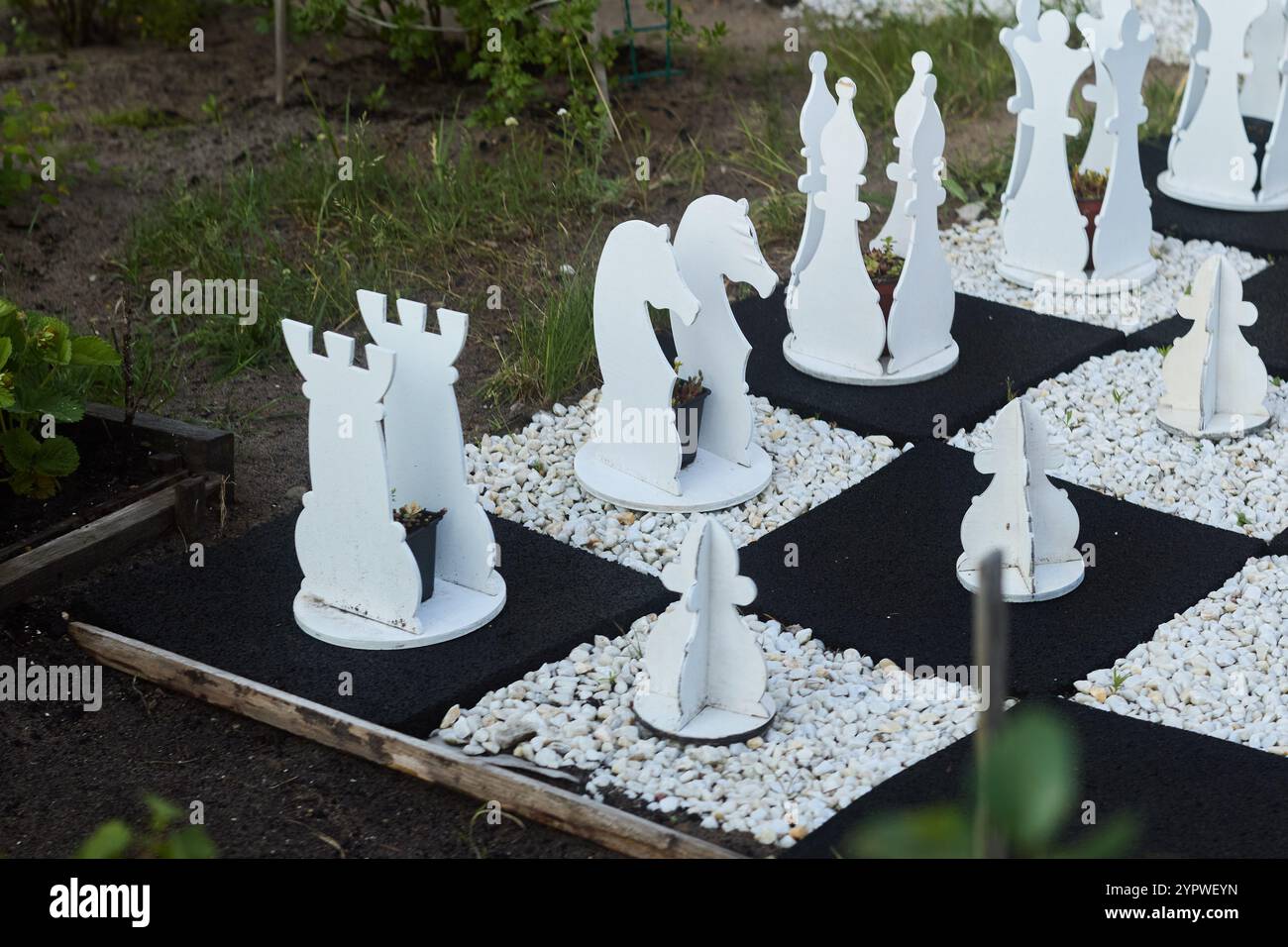 Enjoy a Giant Outdoor Chess Set in a scenic garden, adding excitement ...