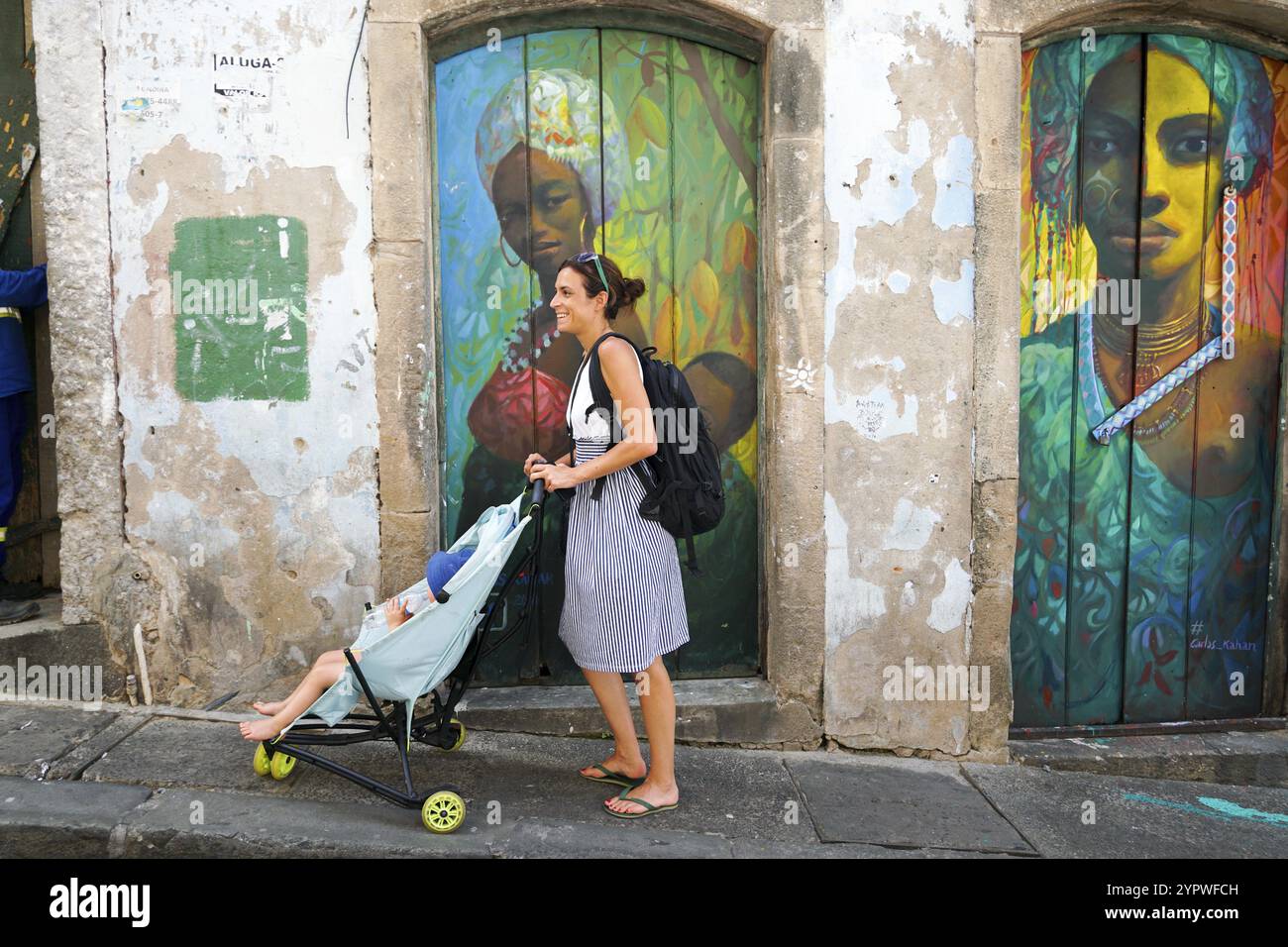 Tourist walking in the colorful historic district of Pelourinho, Bahia ...