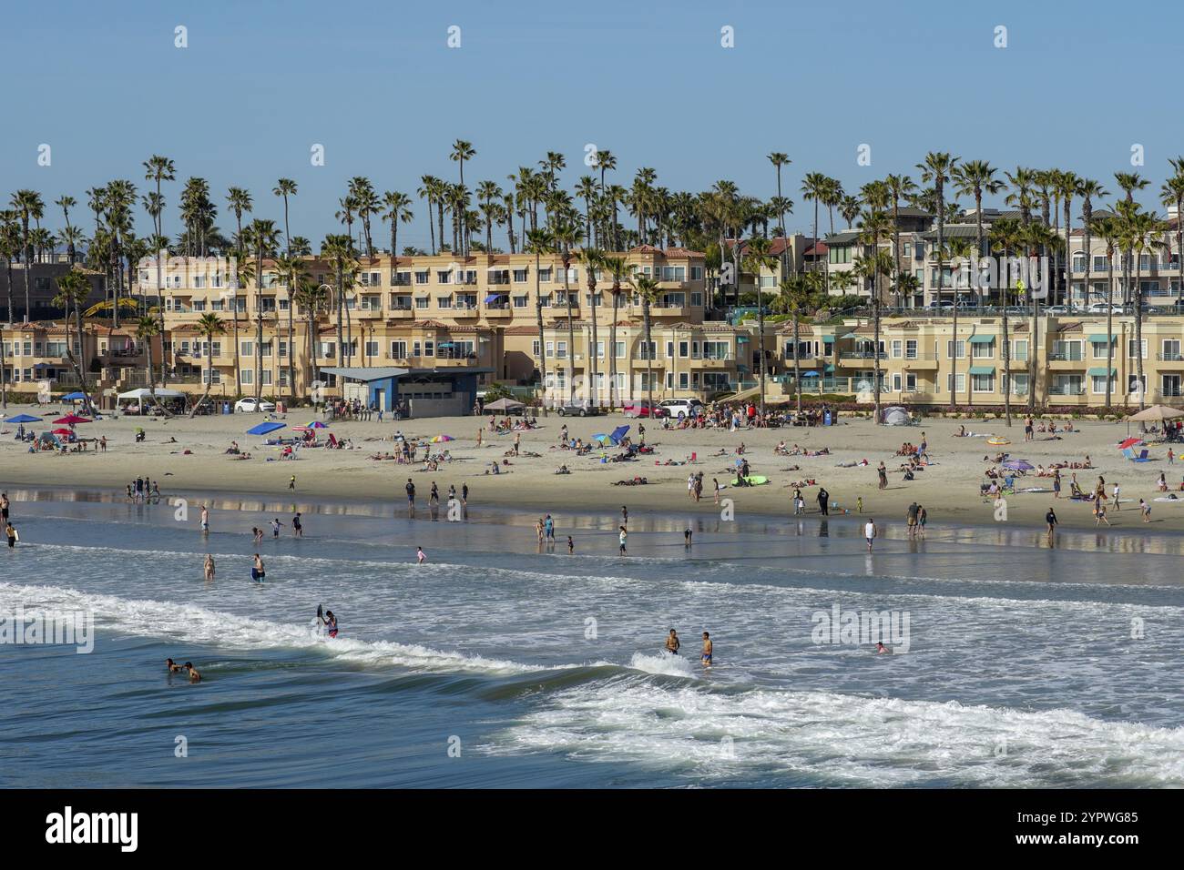 People on the beach enjoying beautiful summer day at Oceanside beach in ...
