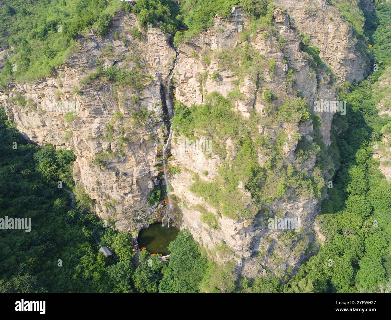 Natural waterfall in the mountain, spring valley, located in Minyun ...