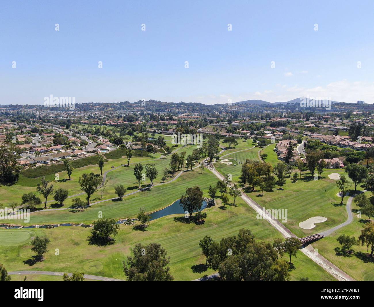 Aerial view of golf in upscale residential neighborhood, Rancho ...