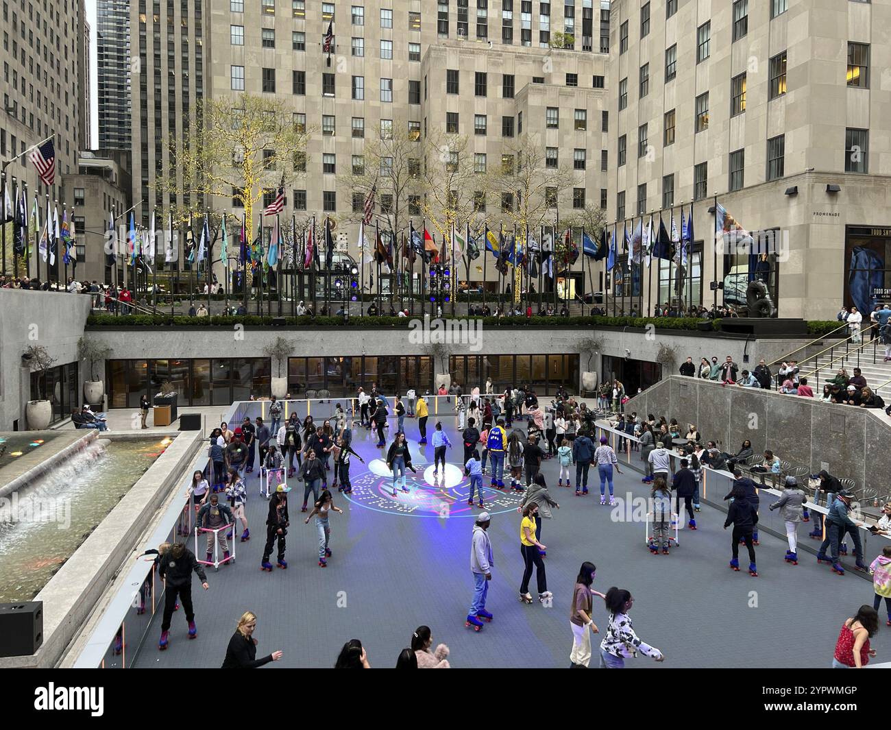 People are seen roller skating at Rockefeller Center in New York City ...