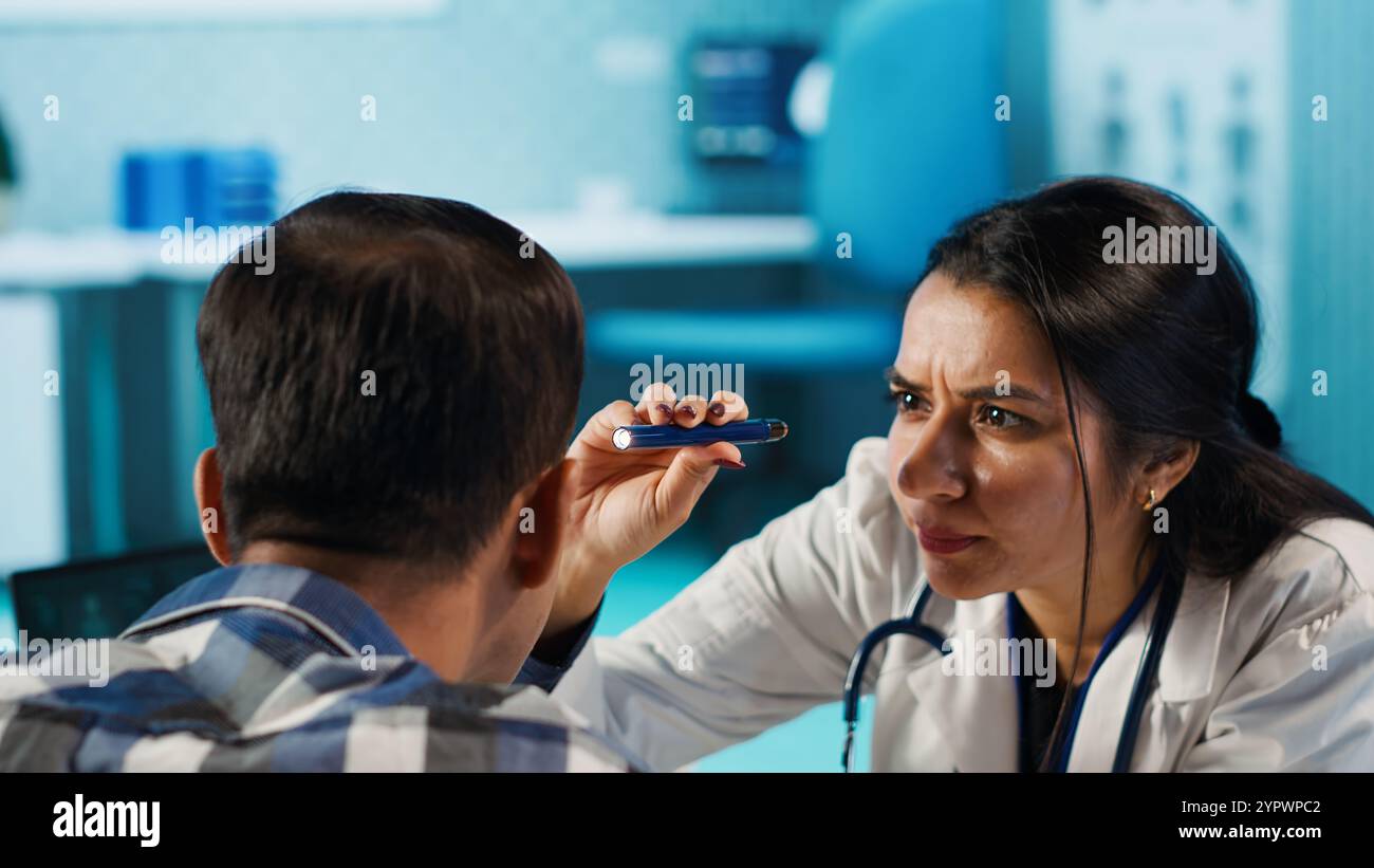 Ophthalmologist specialist checking eyesight of a patient with medical ...