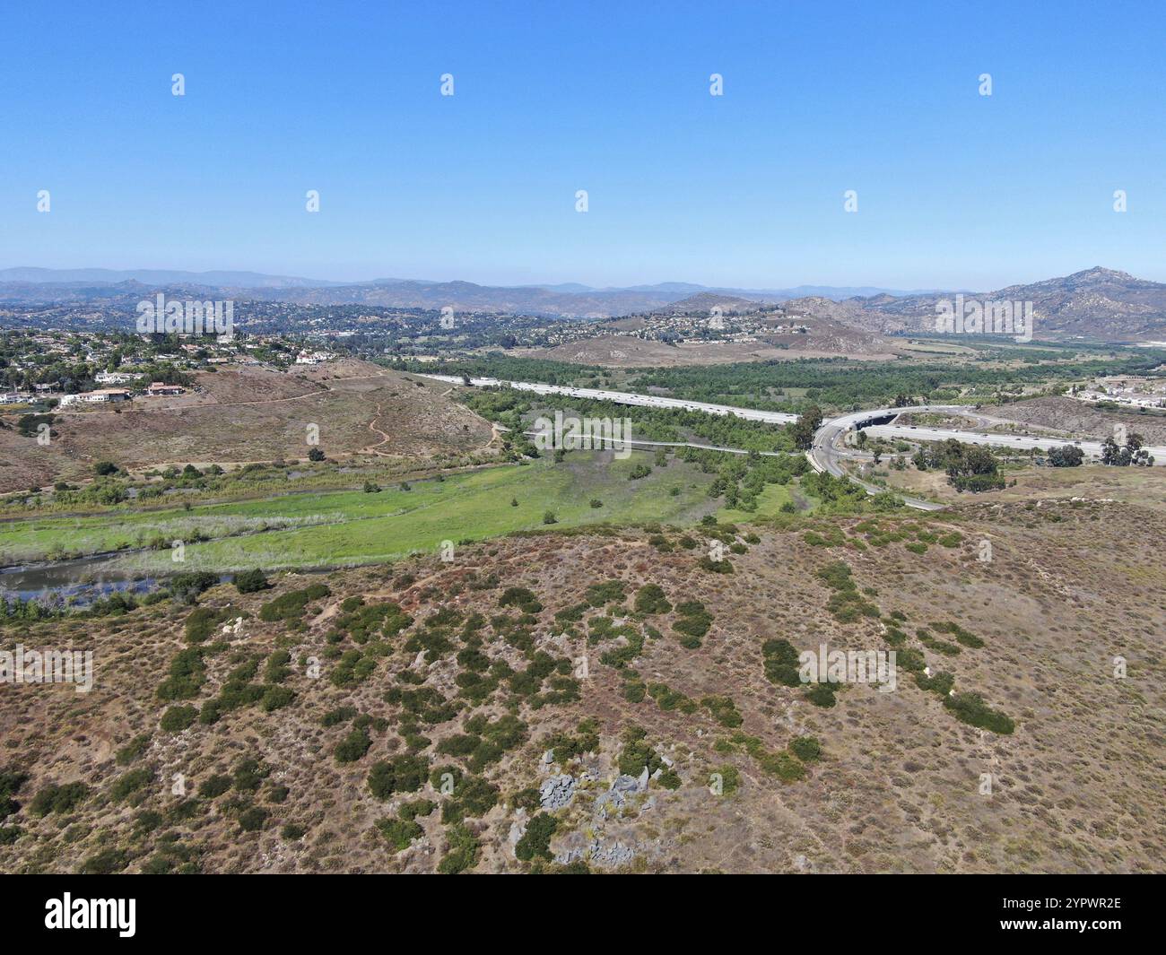 Aerial view of Rancho Bernardo mountain with freeway road on the ...