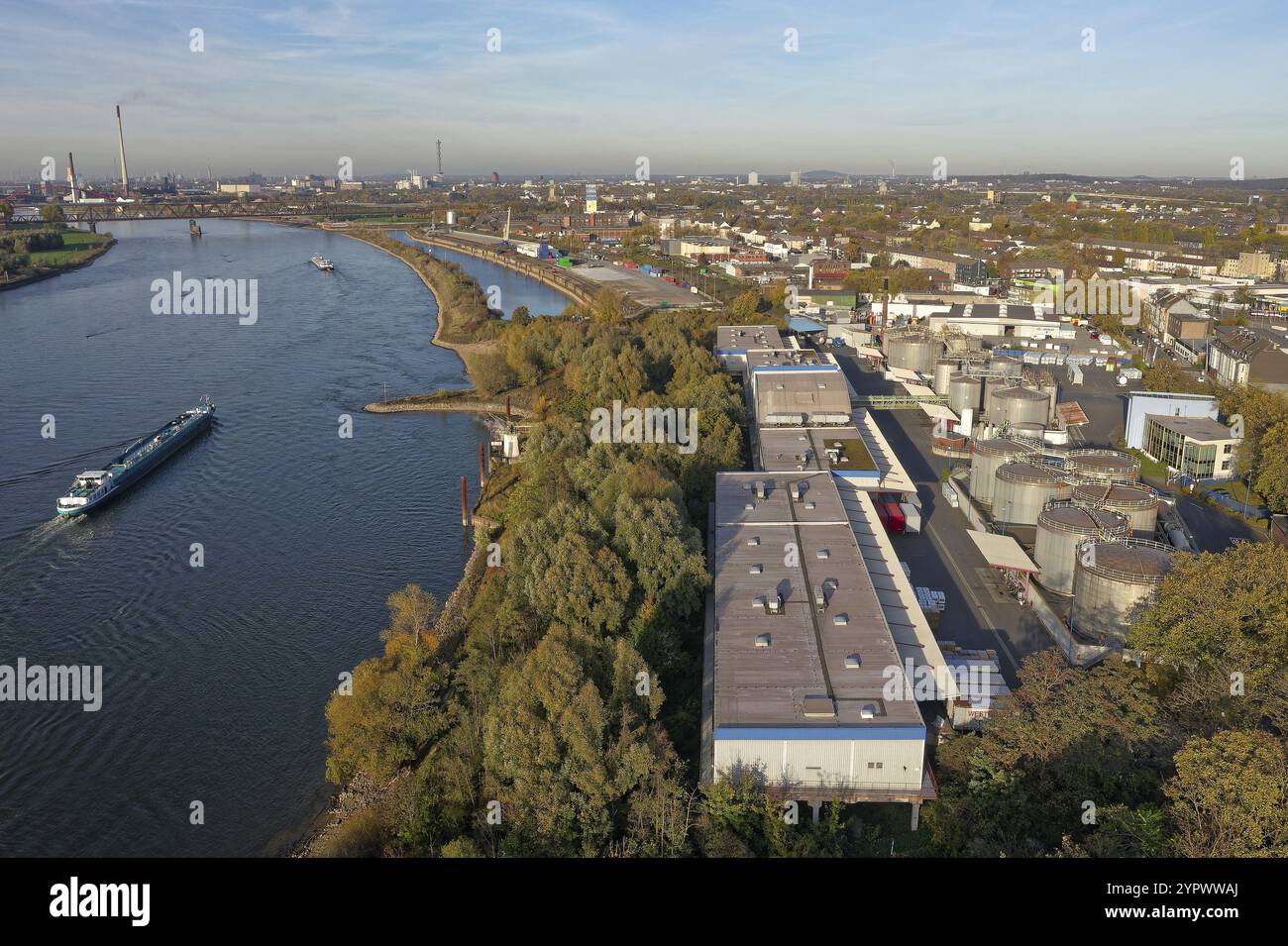 Stainless steel tanks storing chemicals at the Rhine river in Germany ...