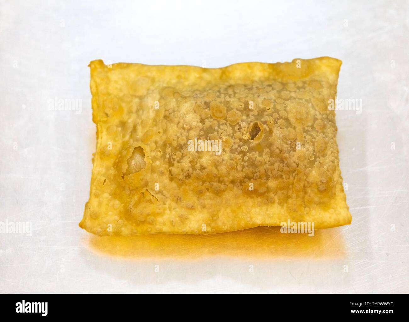 Traditional Brazilian fried pastry stuffed with ground beef. "Pastel de ...