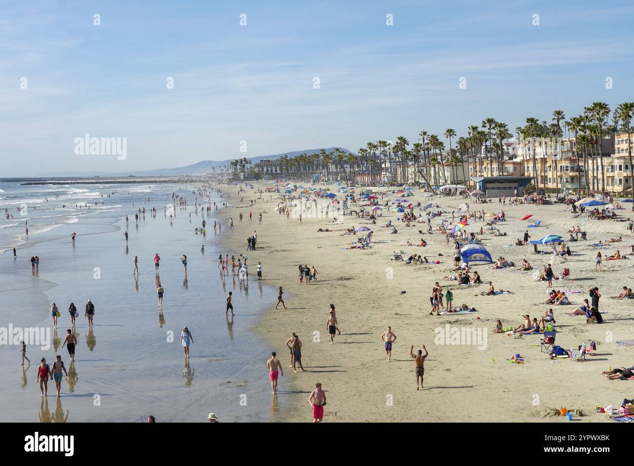 People on the beach enjoying beautiful summer day at Oceanside beach in ...