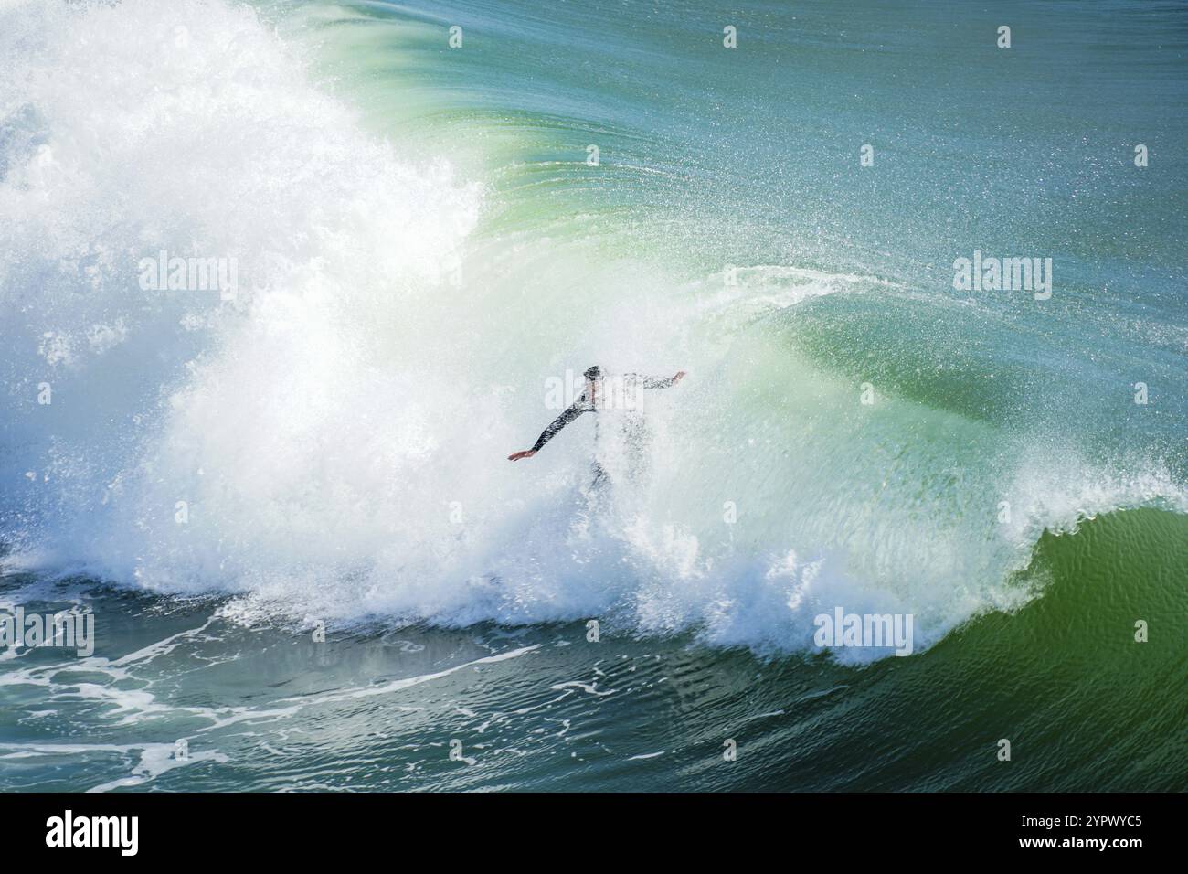 Male surfers enjoying the big wave in Oceanside in North San Diego ...