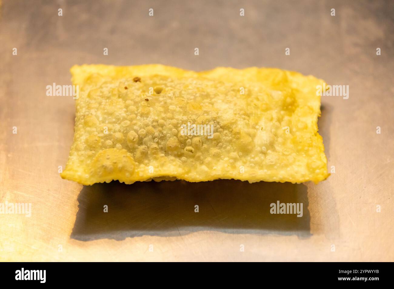 Traditional Brazilian fried pastry stuffed with ground beef. "Pastel de ...