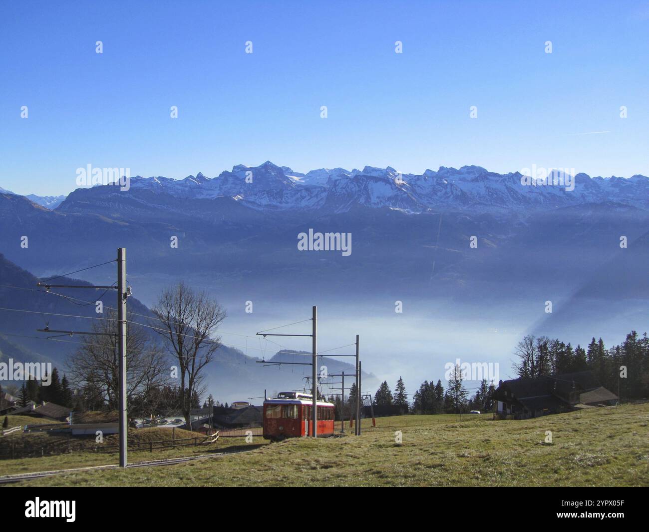 A train of the cog railway climbing mount Rigi, a famous mountain in ...