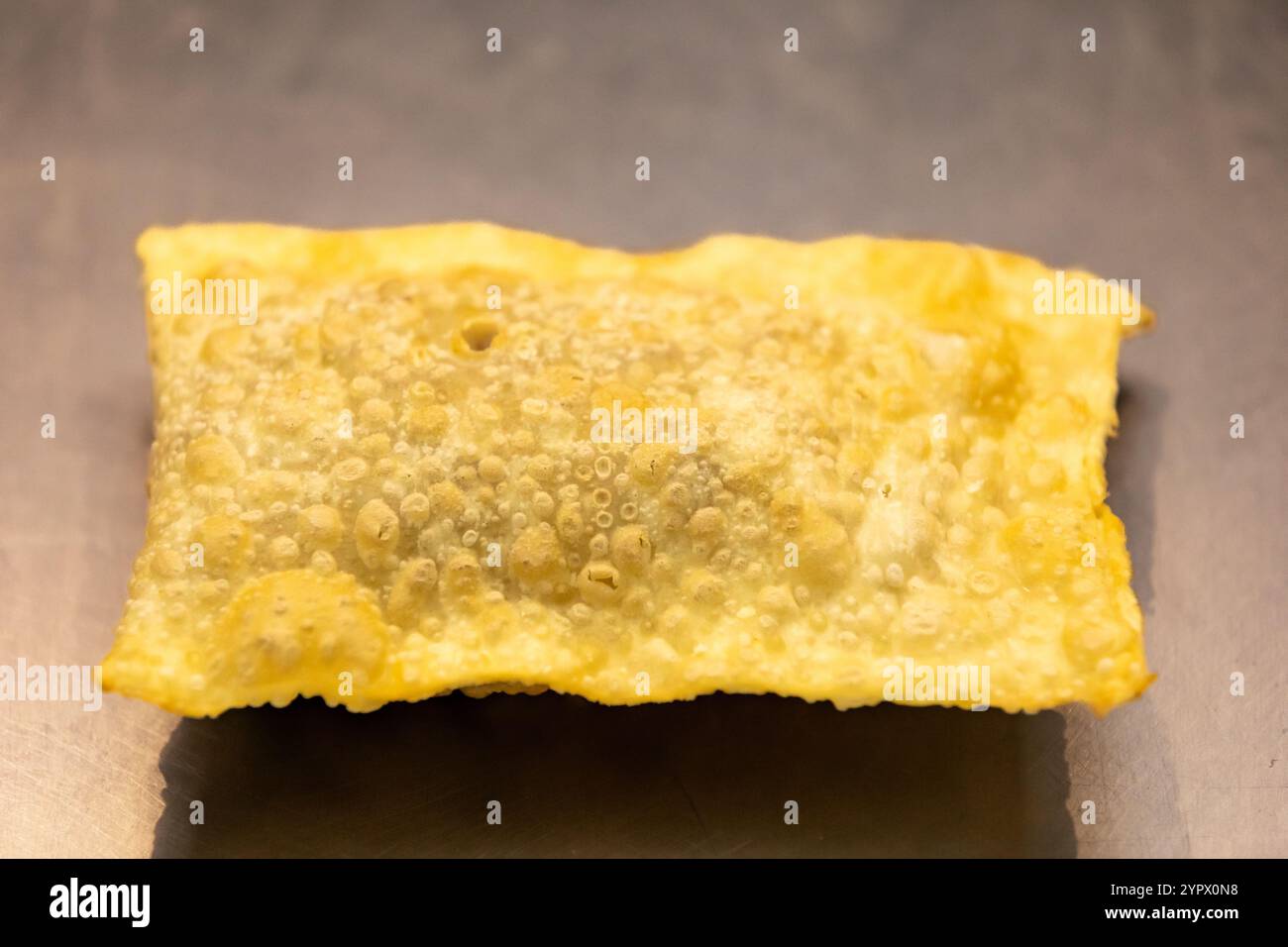 Traditional Brazilian fried pastry stuffed with ground beef. "Pastel de ...