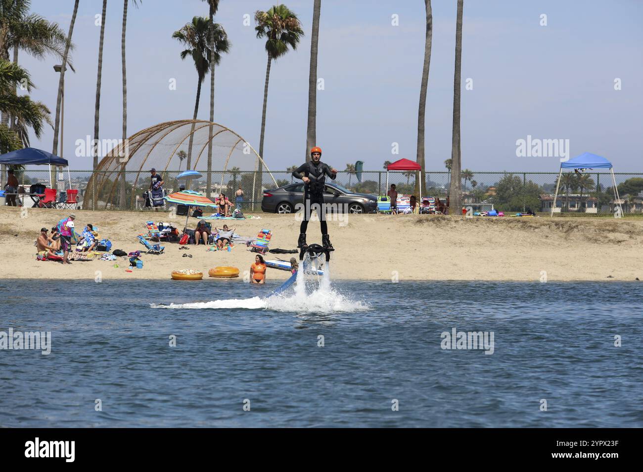 Man flying flyboarding on a Flyboard, hydroflighting device which ...
