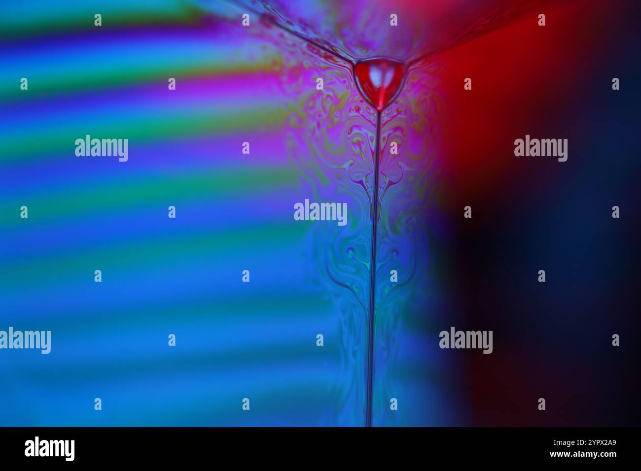 Bright rainbow reflection of liquid in macro, dispersion, surrealistic ...