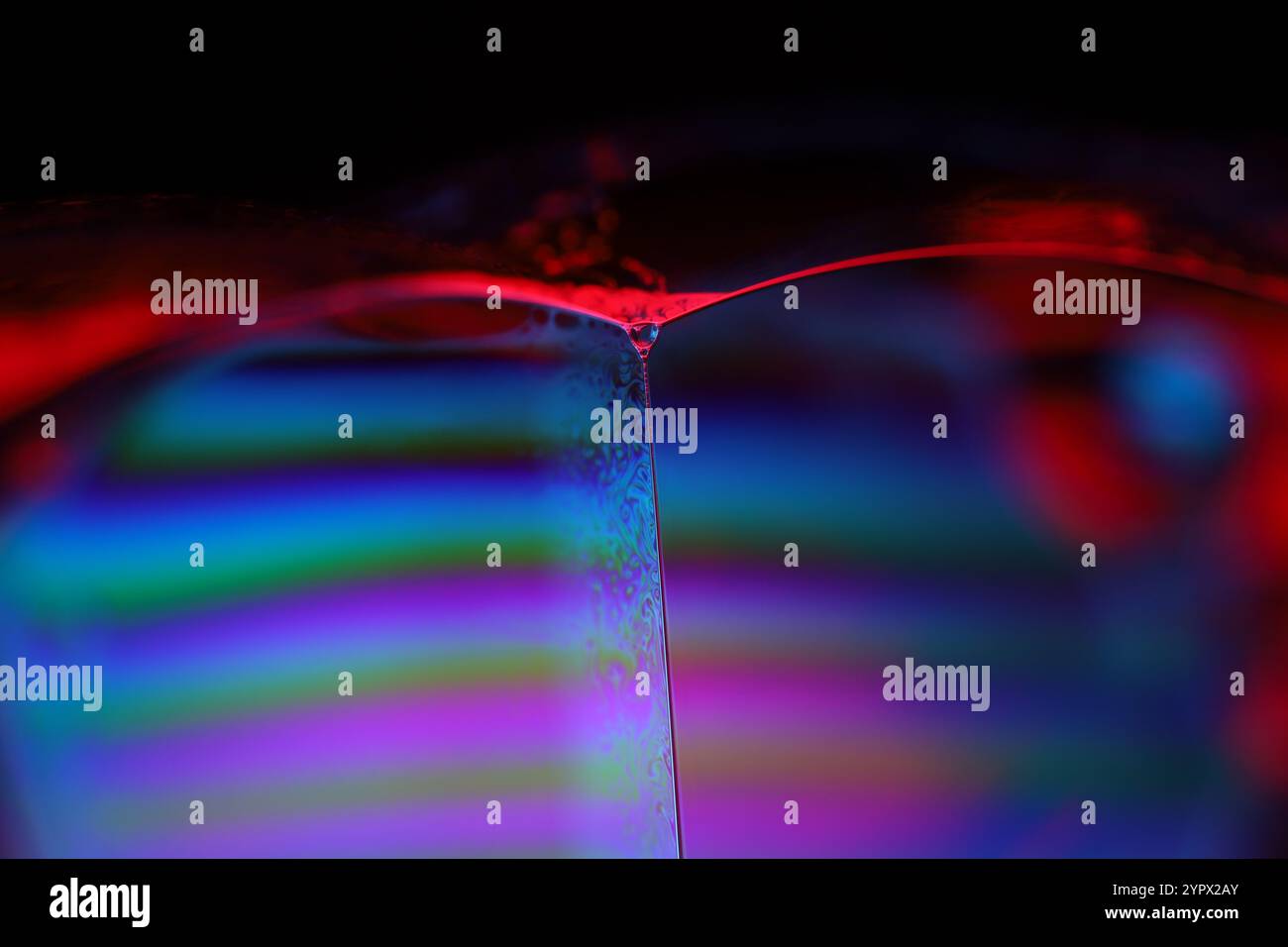 Bright rainbow reflection of liquid in macro, dispersion, surrealistic ...