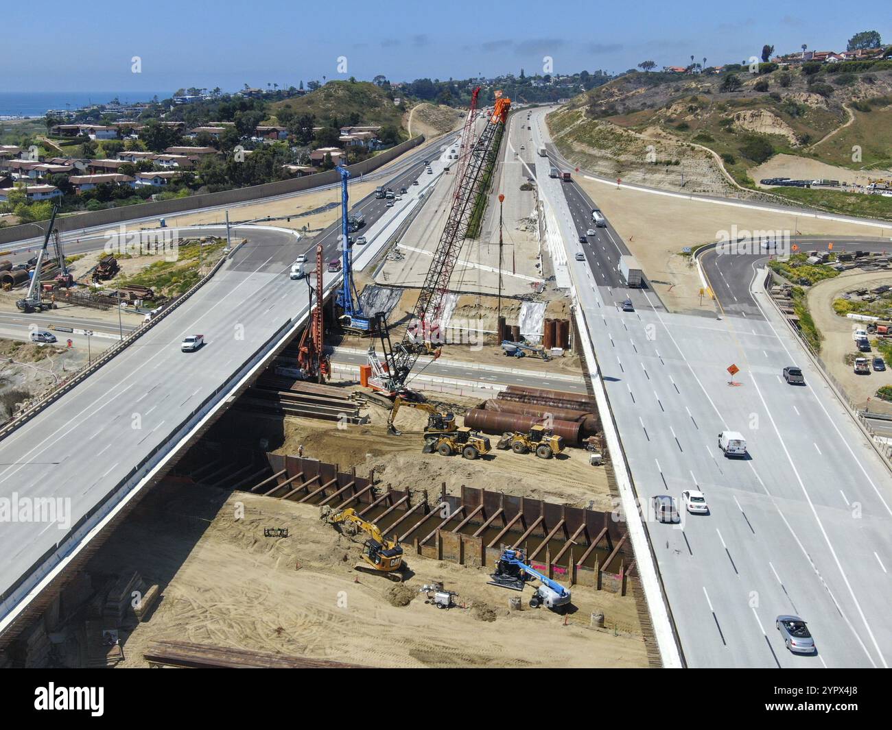 Aerial view of highway bridge construction over small river, San Diego ...