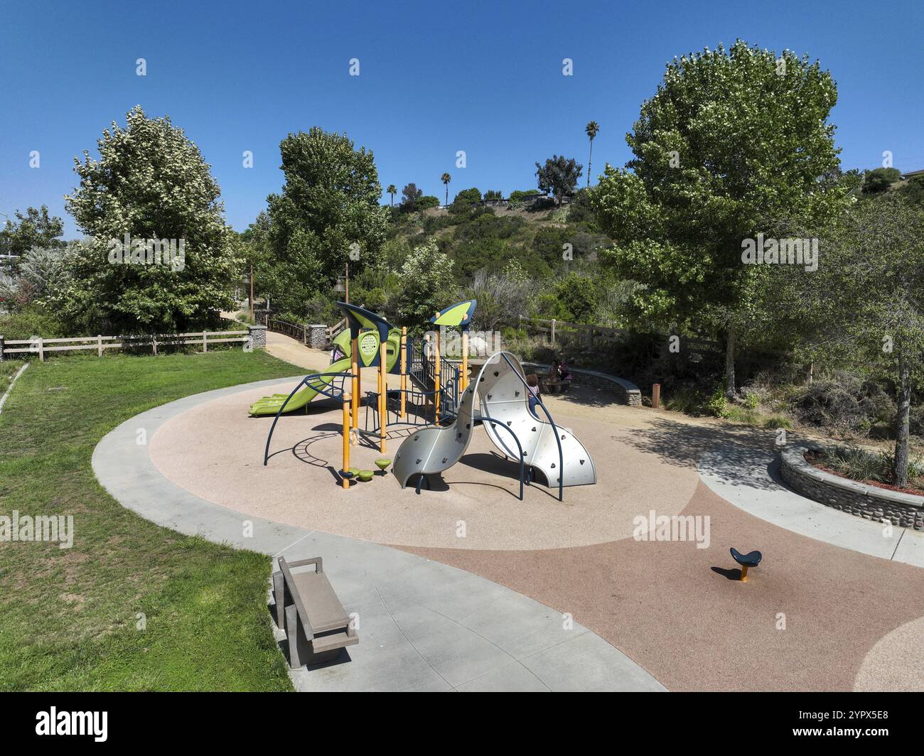 Colorful children playground activities in public park surrounded by ...