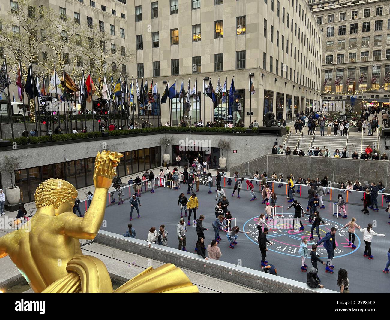 People are seen roller skating at Rockefeller Center in New York City ...