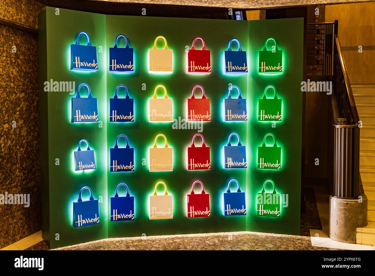 London, UK - November 29, 2024. Exhibition in Harrods store. Paper bags ...