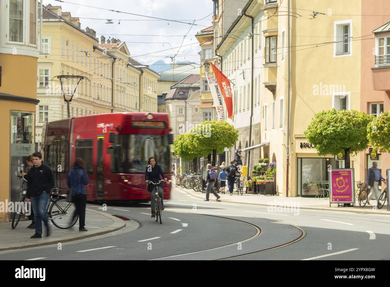 The red coloured trams are typical for the city of Innsbruck Austria ...