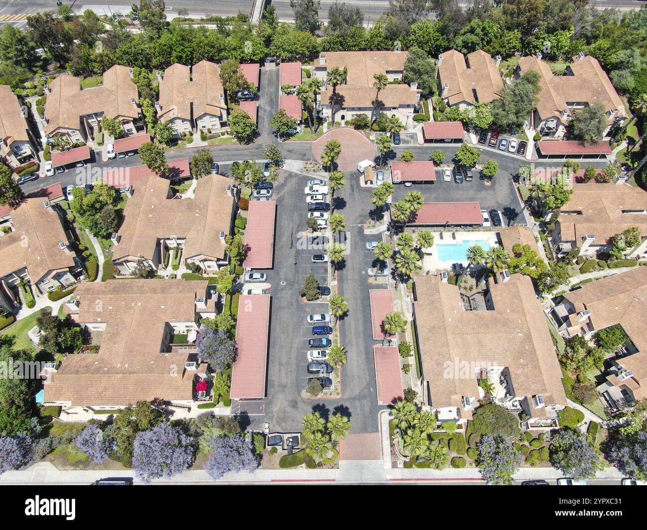 Aerial view middle class neighborhood with private condo community in ...