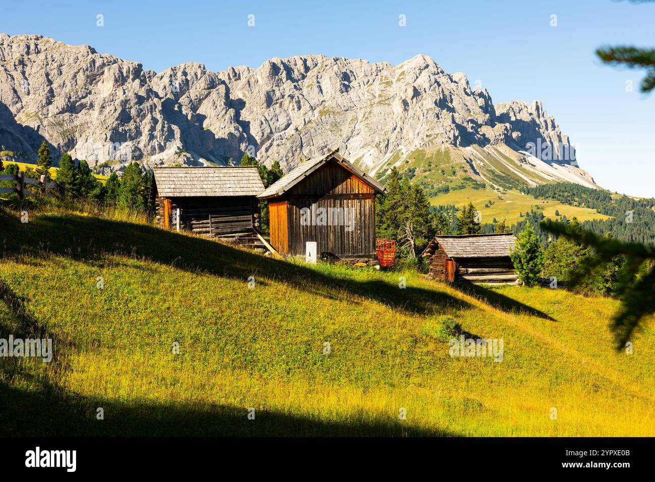Wooden farm building on hillside in Dolomites Stock Photo - Alamy