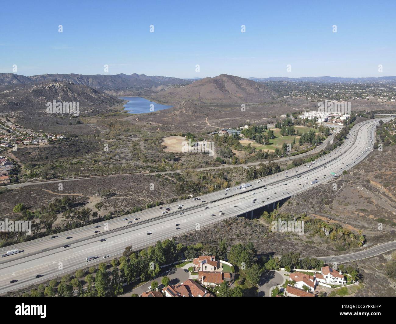 Aerial view of highway with traffic surrounded by houses, Interstate 15 ...
