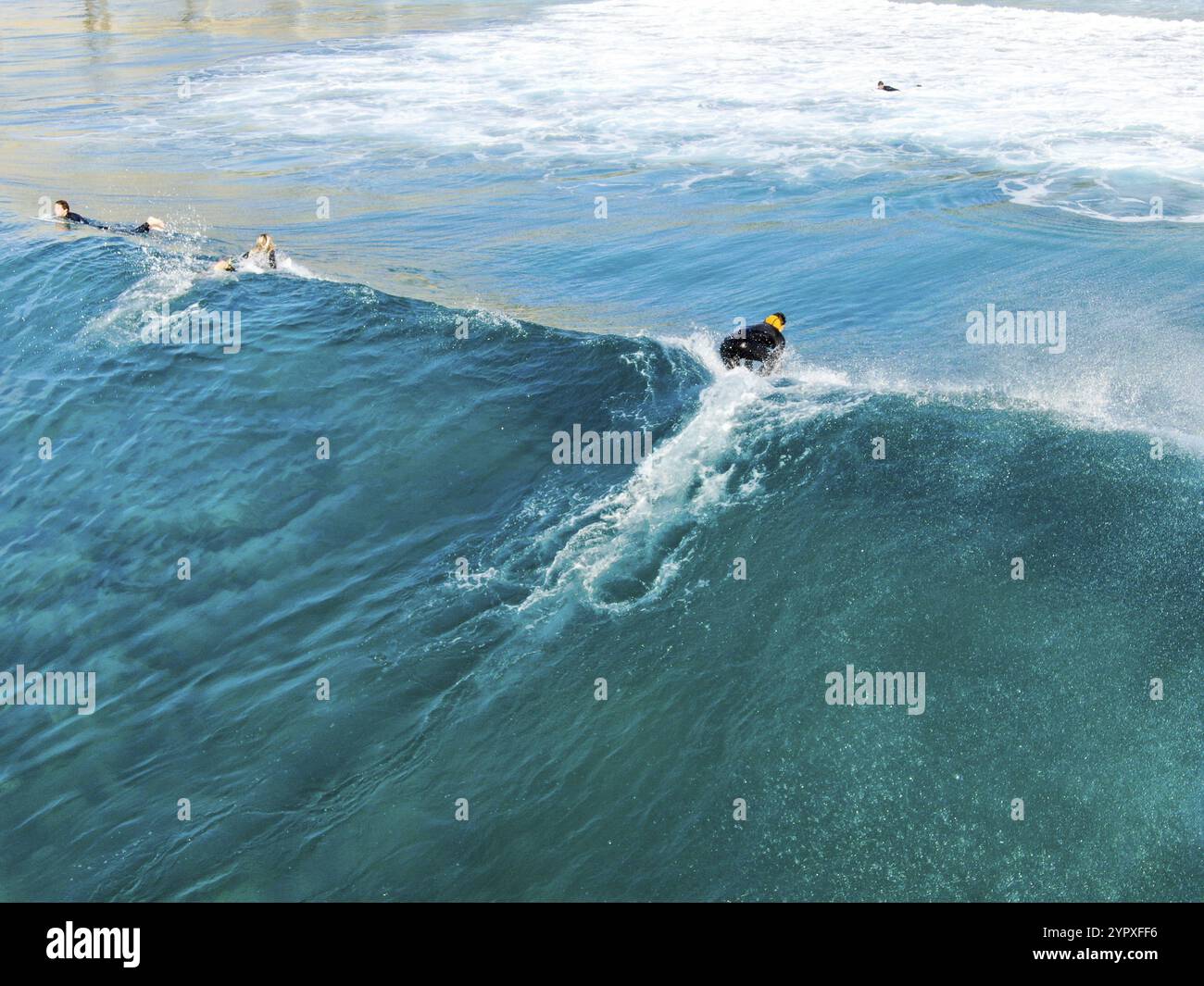 Aerial surfers paddling waiting wave hi-res stock photography and ...