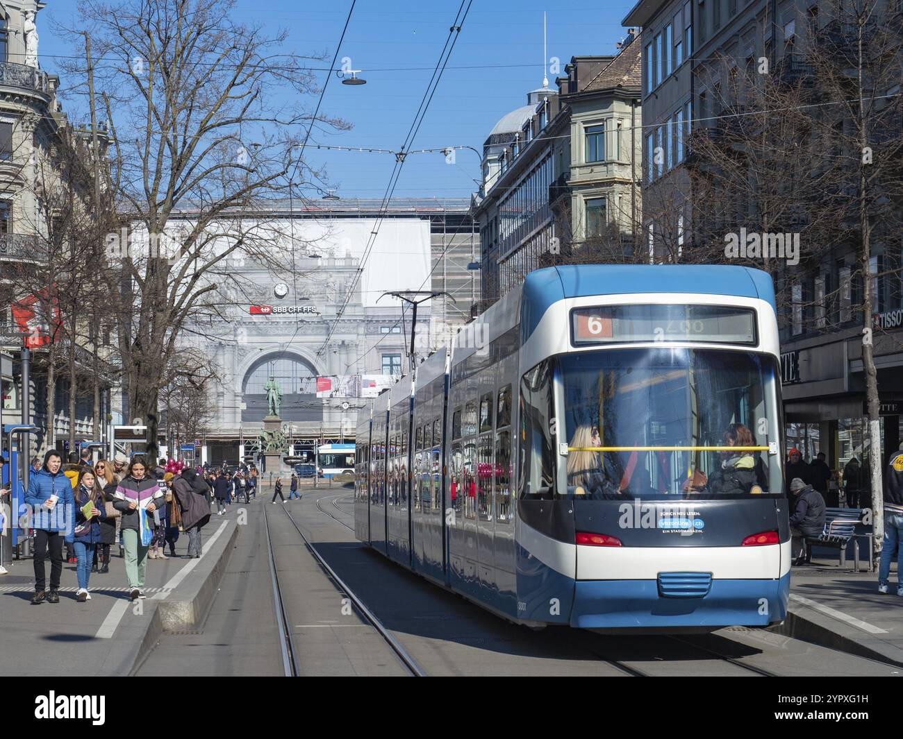 A tram stopping at one of the most frequented public transport stops in ...