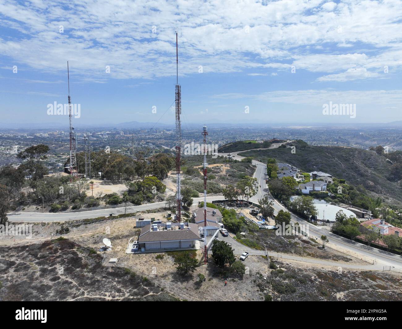 Engineer with safety equipment on high tower for working telecom ...