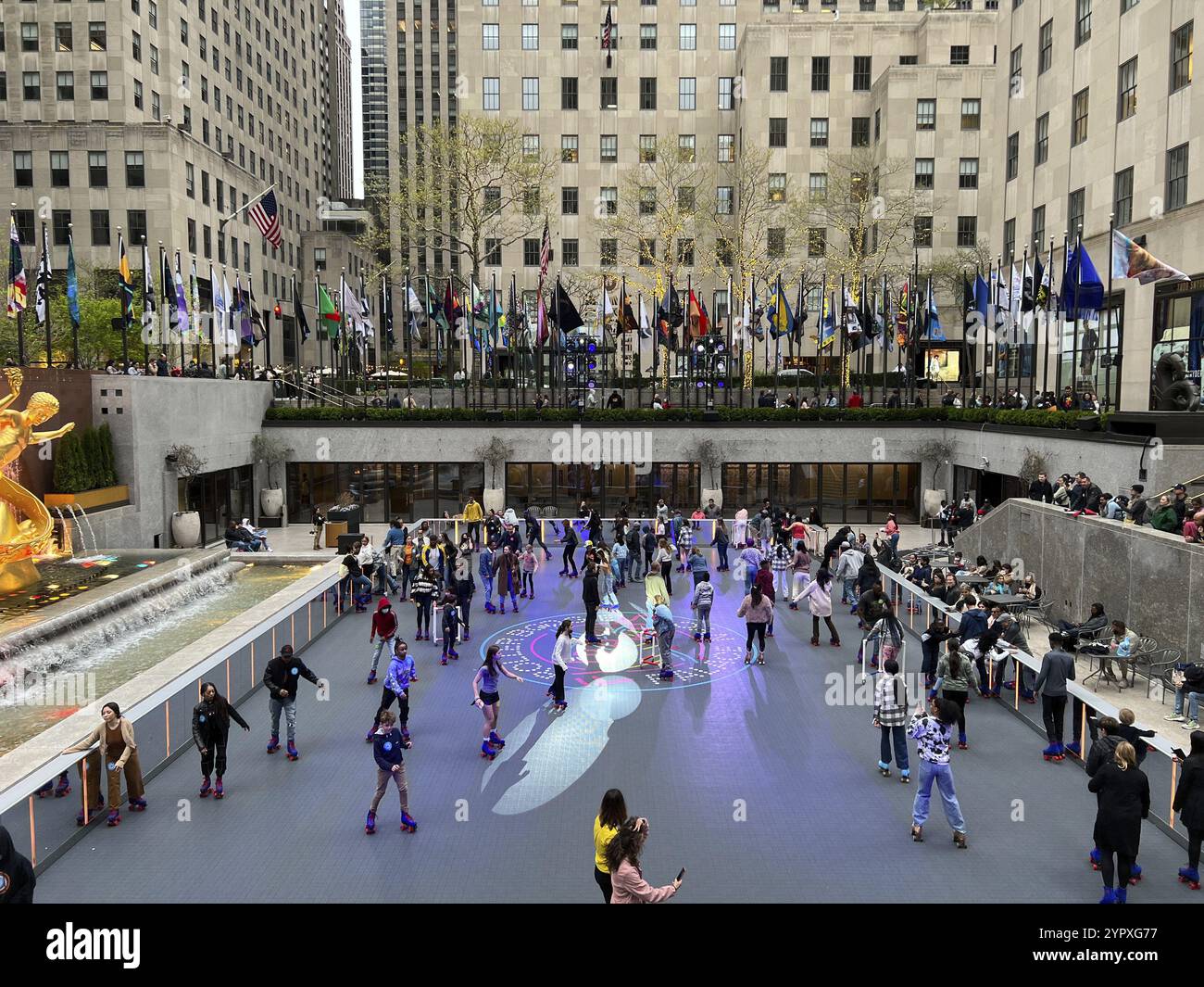 People are seen roller skating at Rockefeller Center in New York City ...