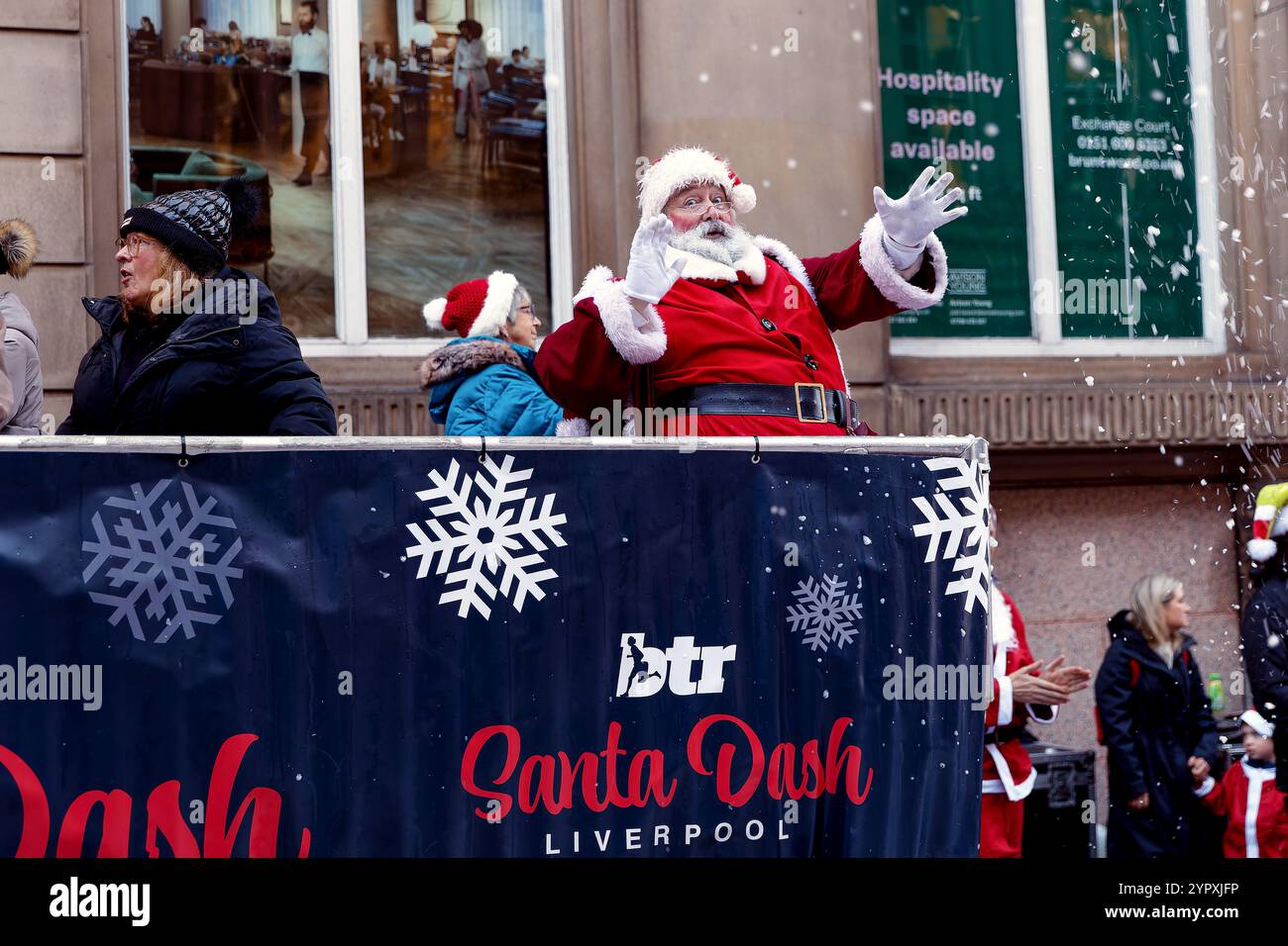 Liverpool, UK. 01st Dec, 2024. A man in Santa Claus costume seen during ...