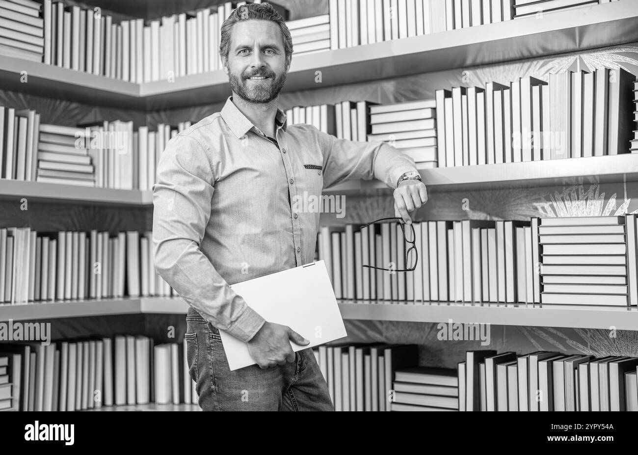 school library full of books. man tutor at bookstore. knowledge and ...