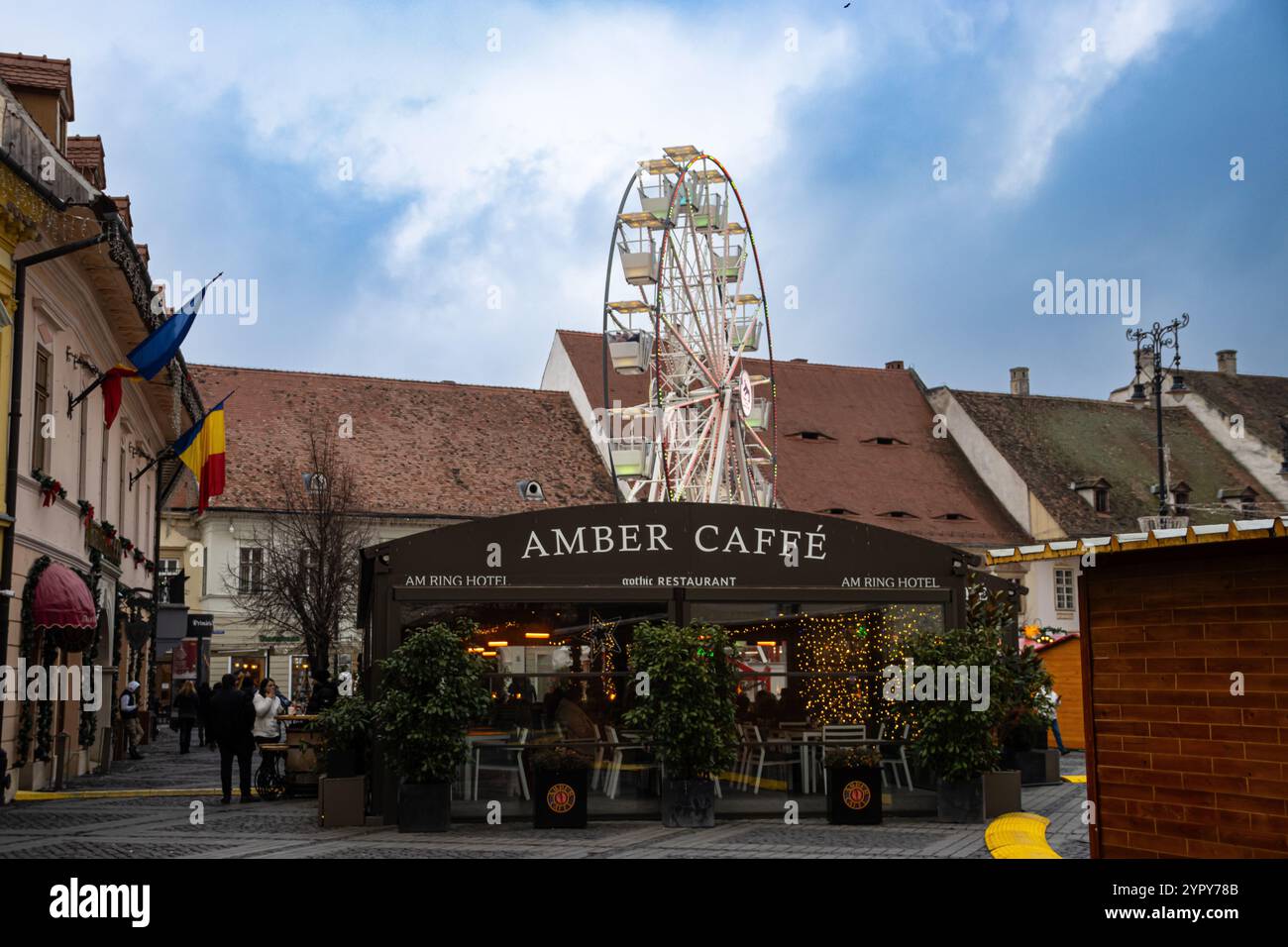 Amber Cafe in front of a ferris wheel at the Christmas Market in Sibiu ...