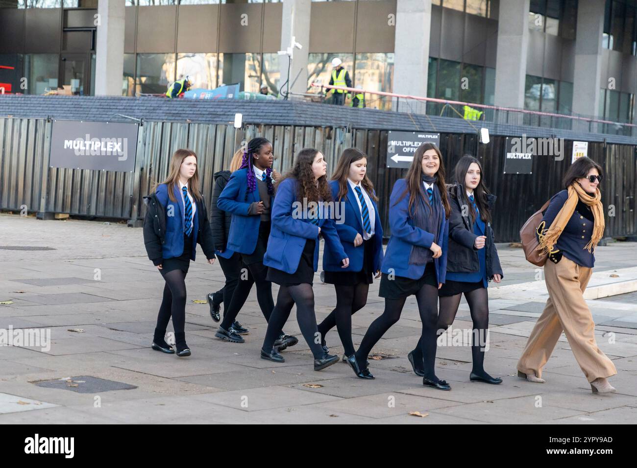 London, UK - November 29, 2024. Schoolgirls in identical uniforms ...