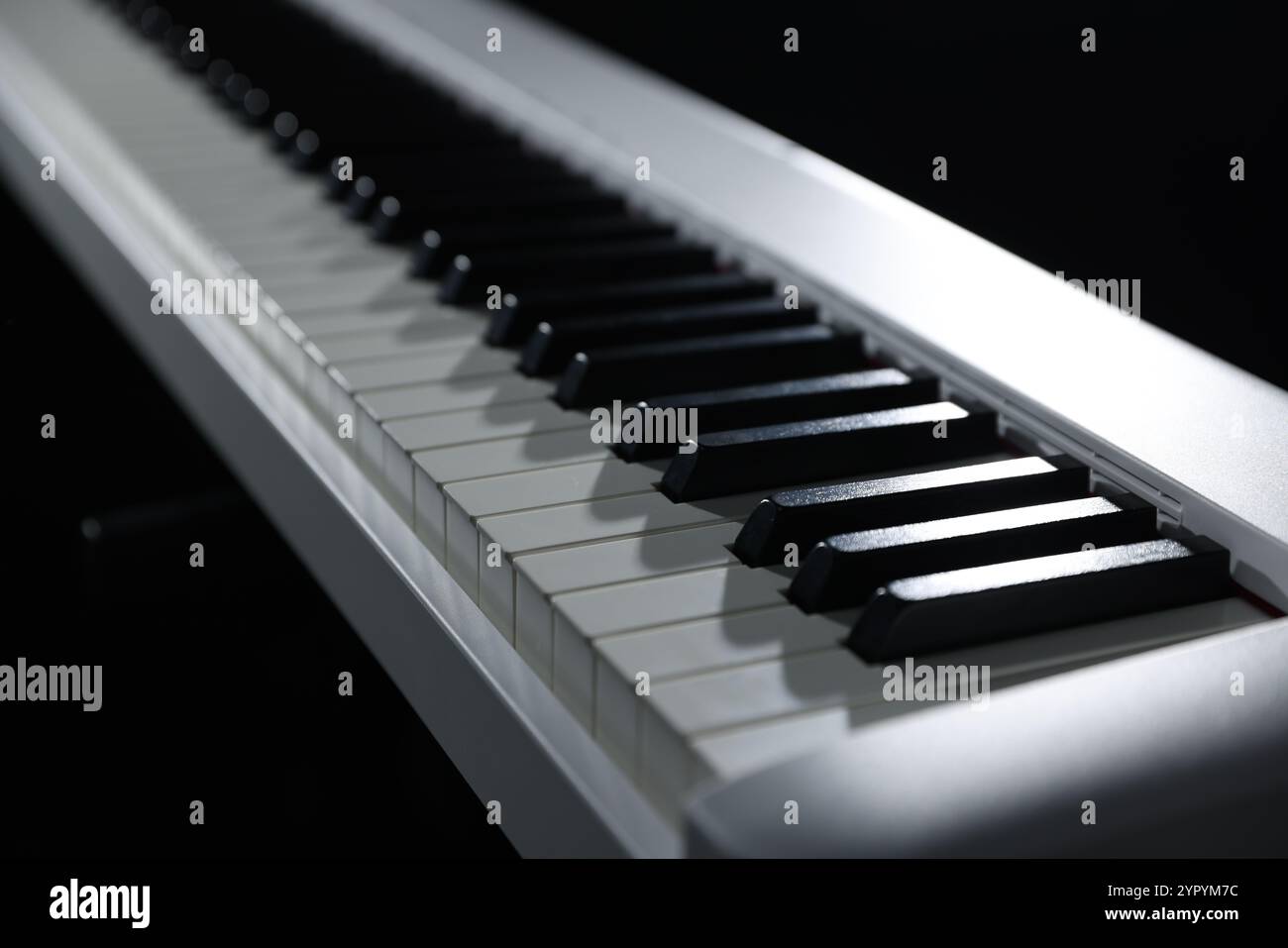 Synthesizer on black background, closeup. Electronic musical instrument ...