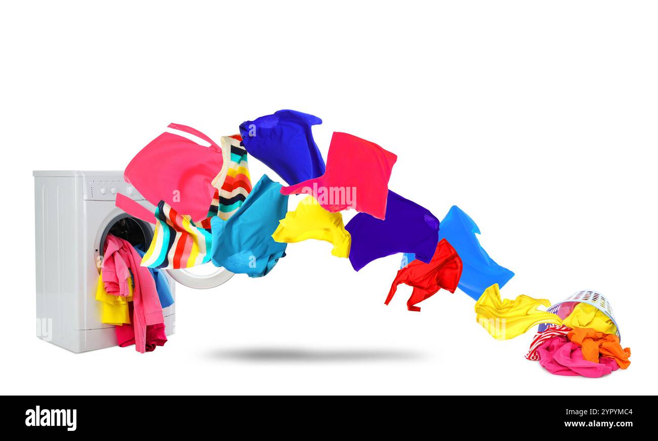 Clean colorful clothes flying out of washing machine into laundry ...