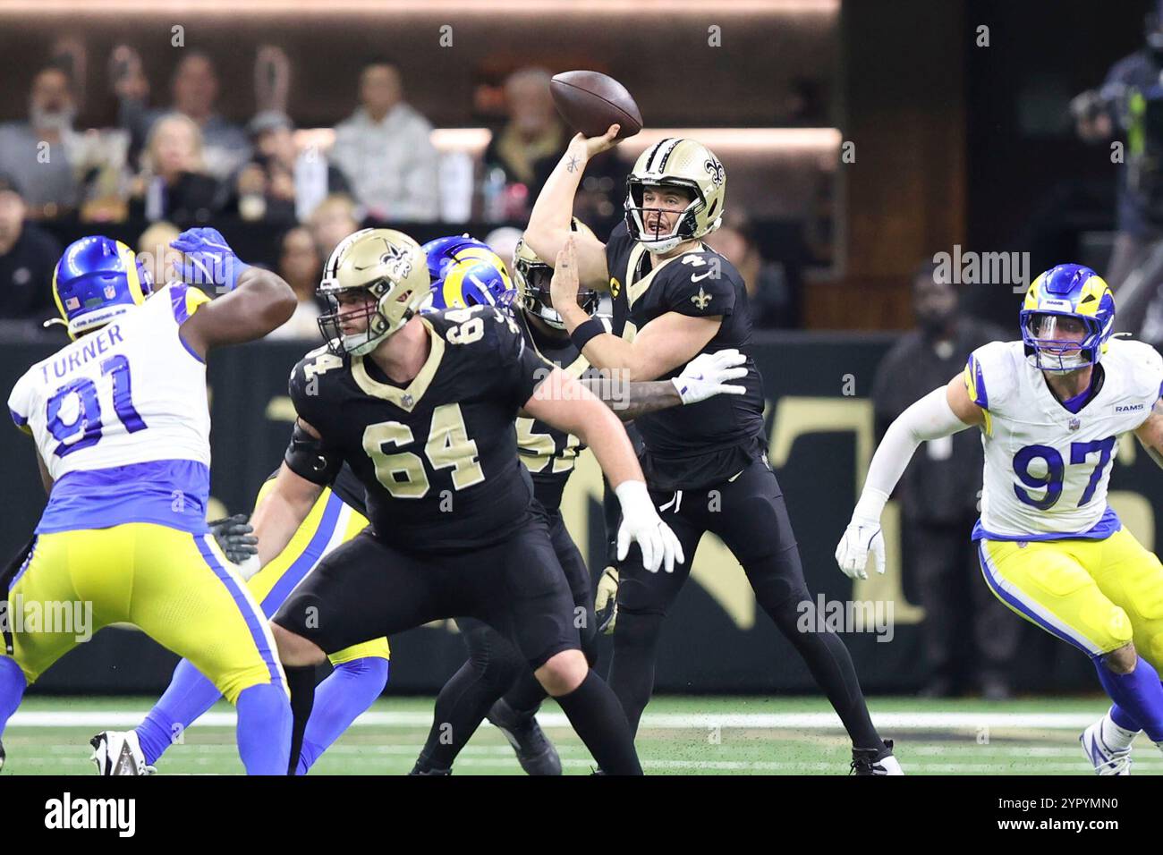 New Orleans Saints quarterback Derek Carr (4) is hit while in the act ...
