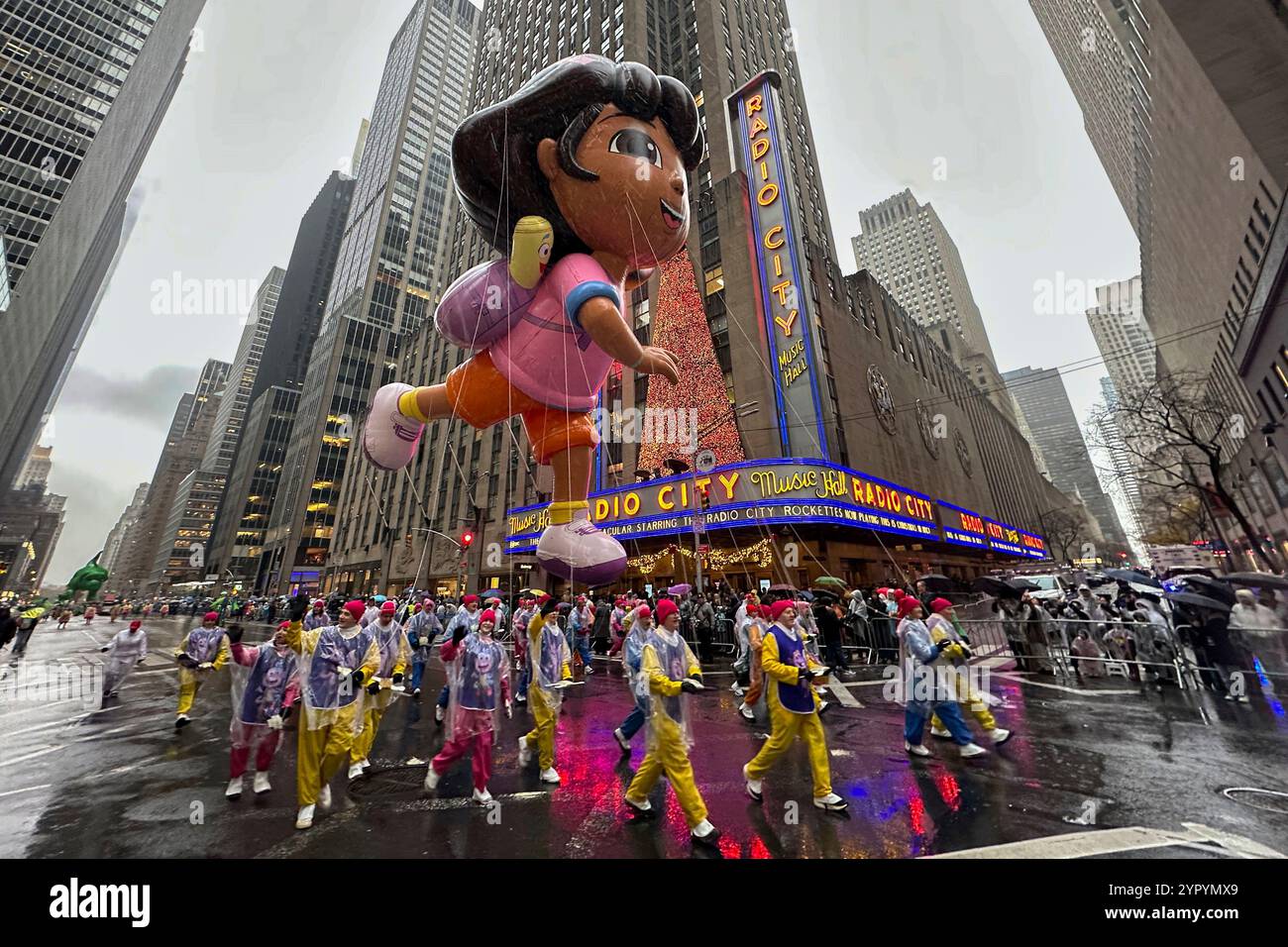 The Dora the Explorer balloon flies in front of Radio City Music Hall ...
